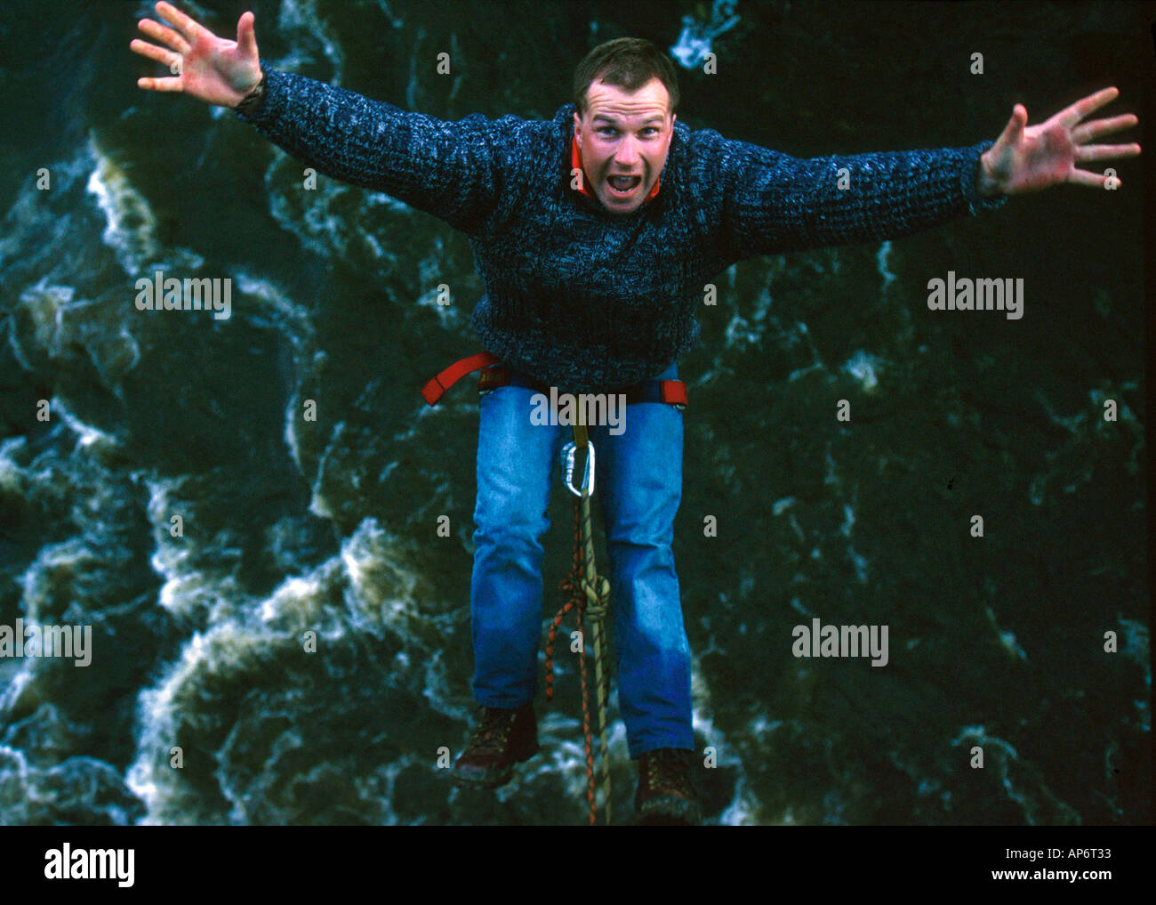 BRIDGE SWINGING ACTION Stock Photo - Alamy