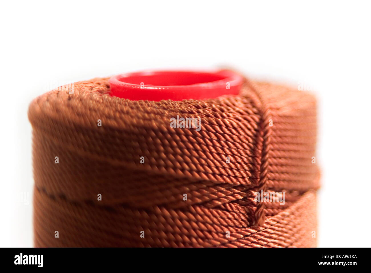 spool of string on white background Stock Photo - Alamy