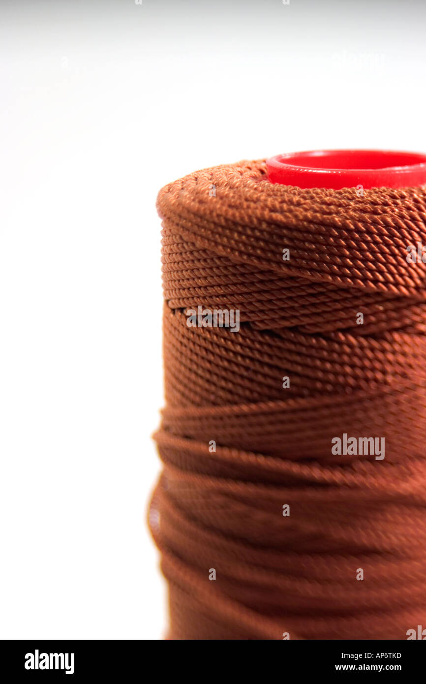 spool of string on white background Stock Photo - Alamy