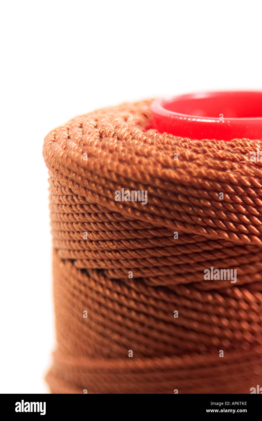 spool of string on white background Stock Photo - Alamy