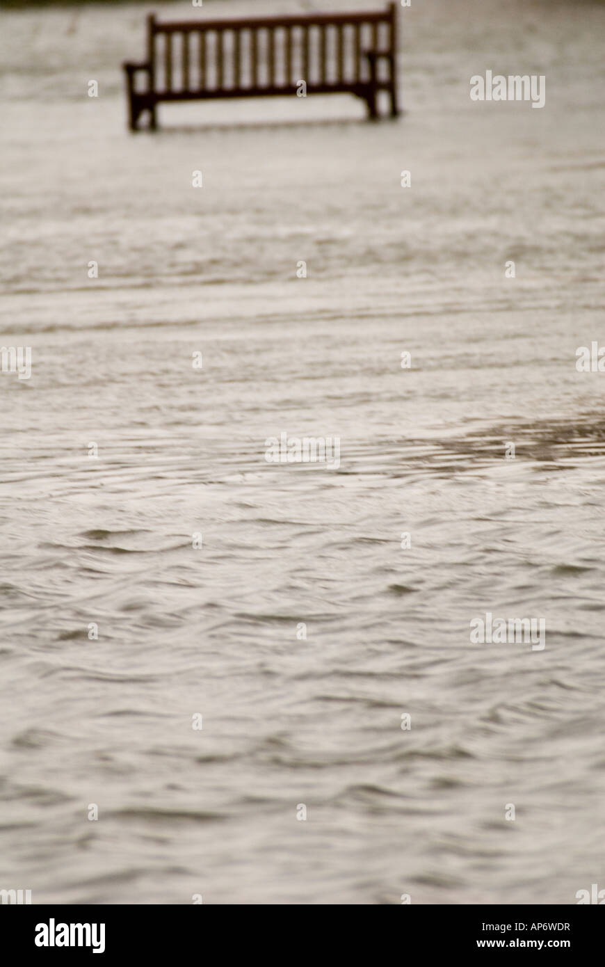 Flooded Park Bench on the breached banks of the River Thames Abingdon ...