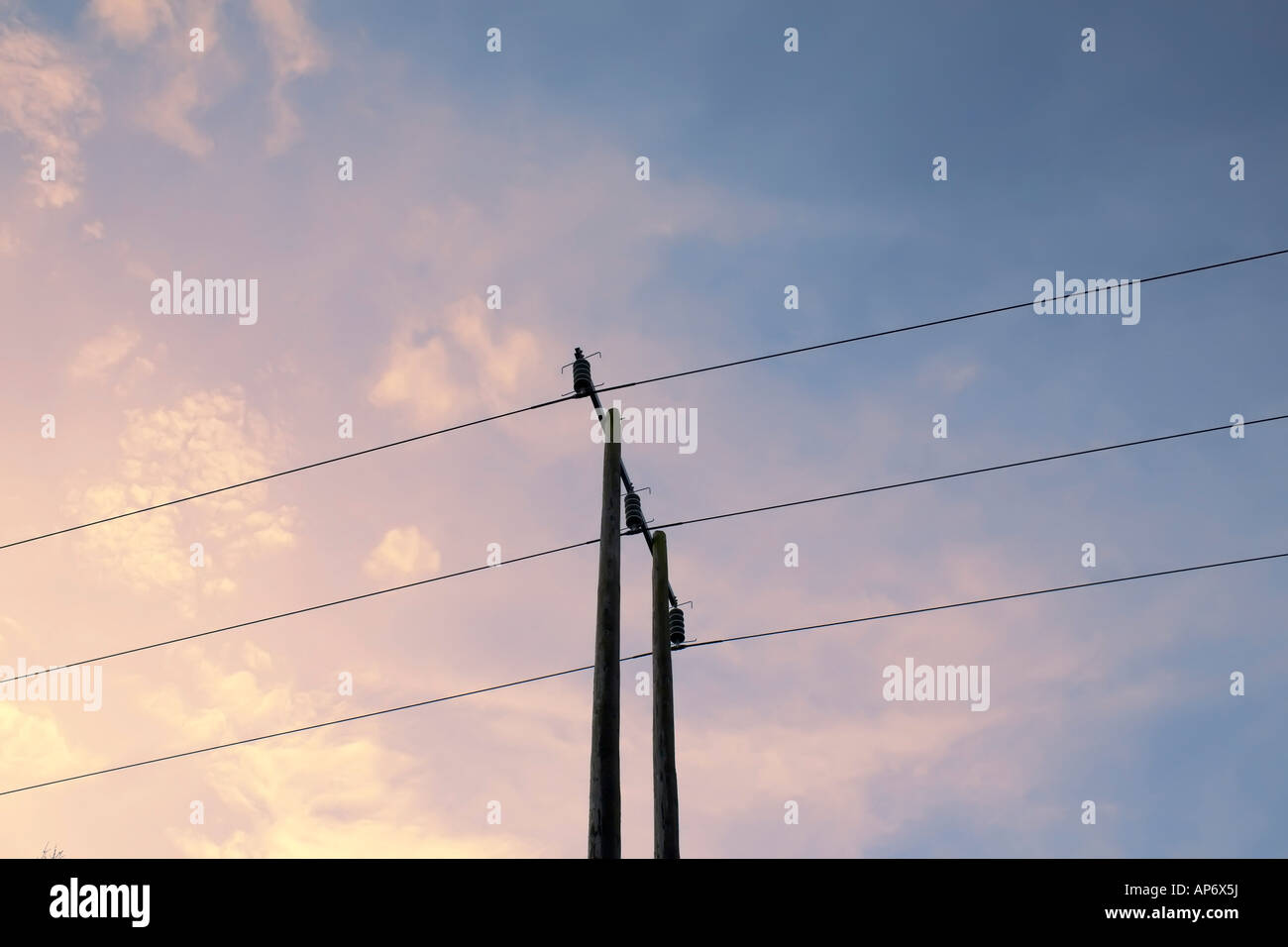 A telephone cable and mast against a sunset Stock Photo - Alamy