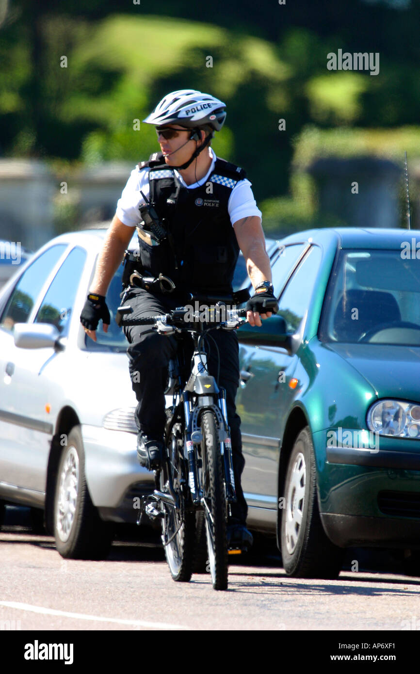 Police Officer patrolling on mountain bike Cowes Isle of Wight England ...