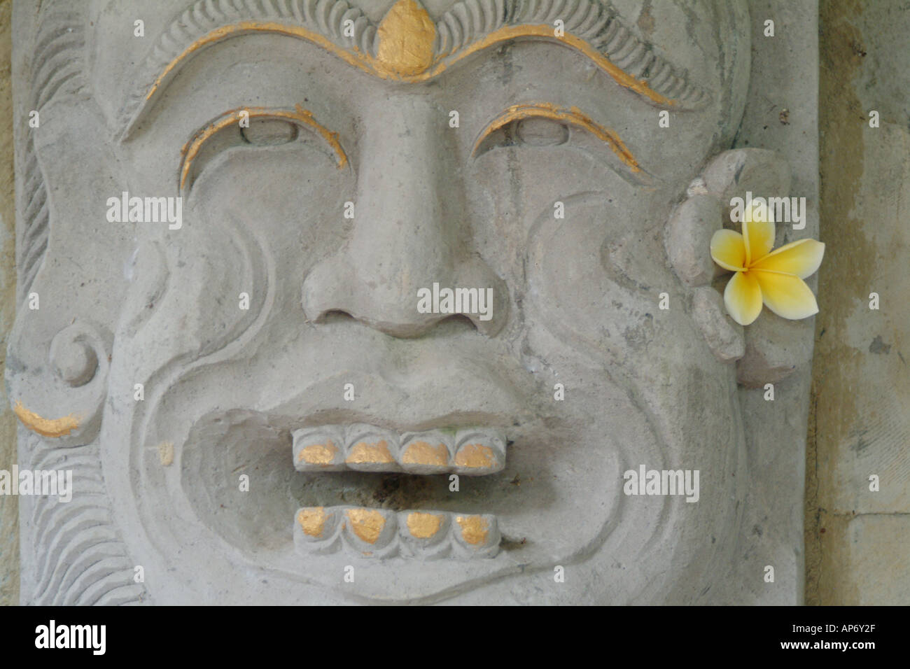Stone carved face Bali Indonesia Stock Photo - Alamy