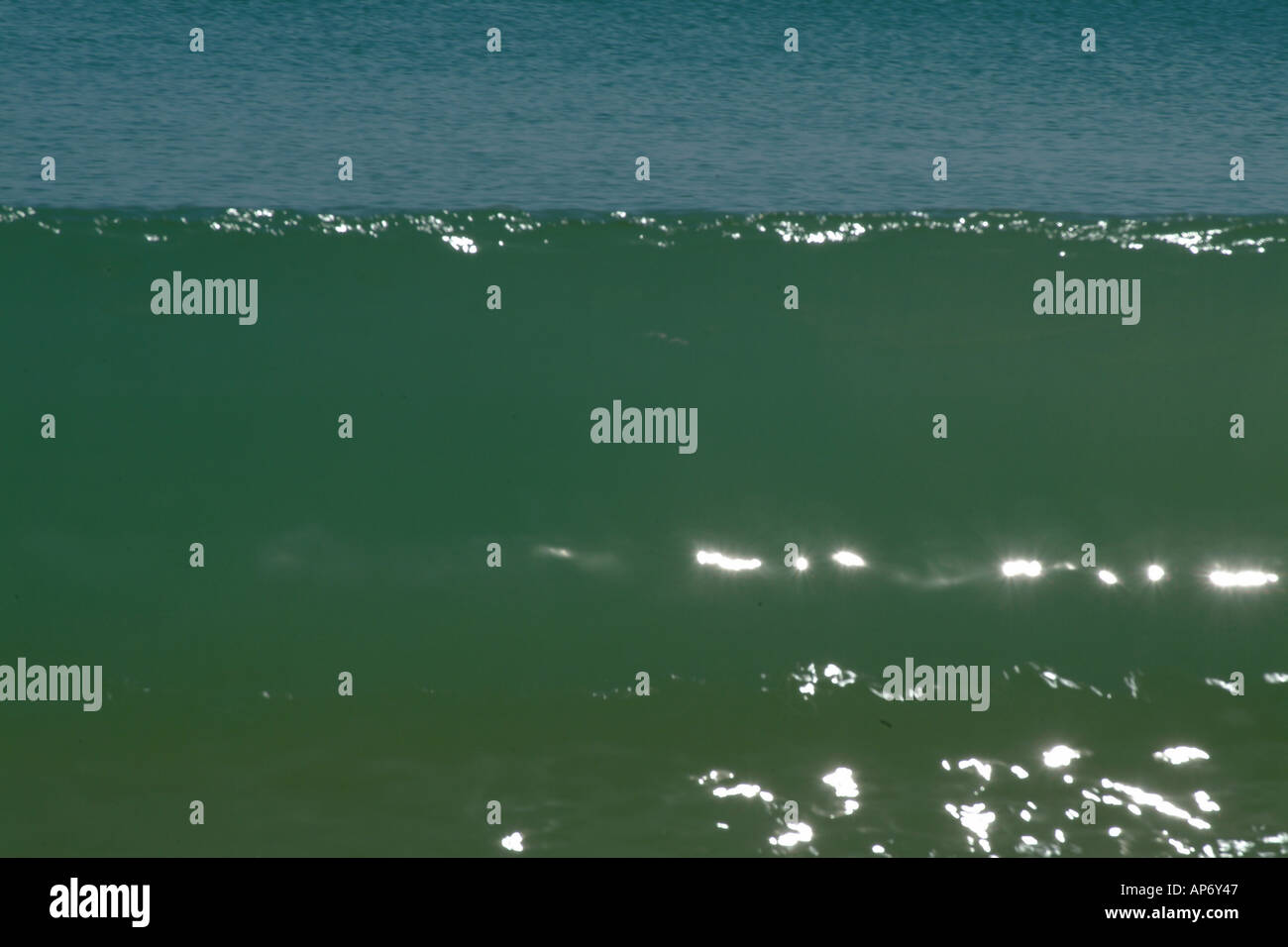 Wave breaks on a beach shoreline Stock Photo - Alamy