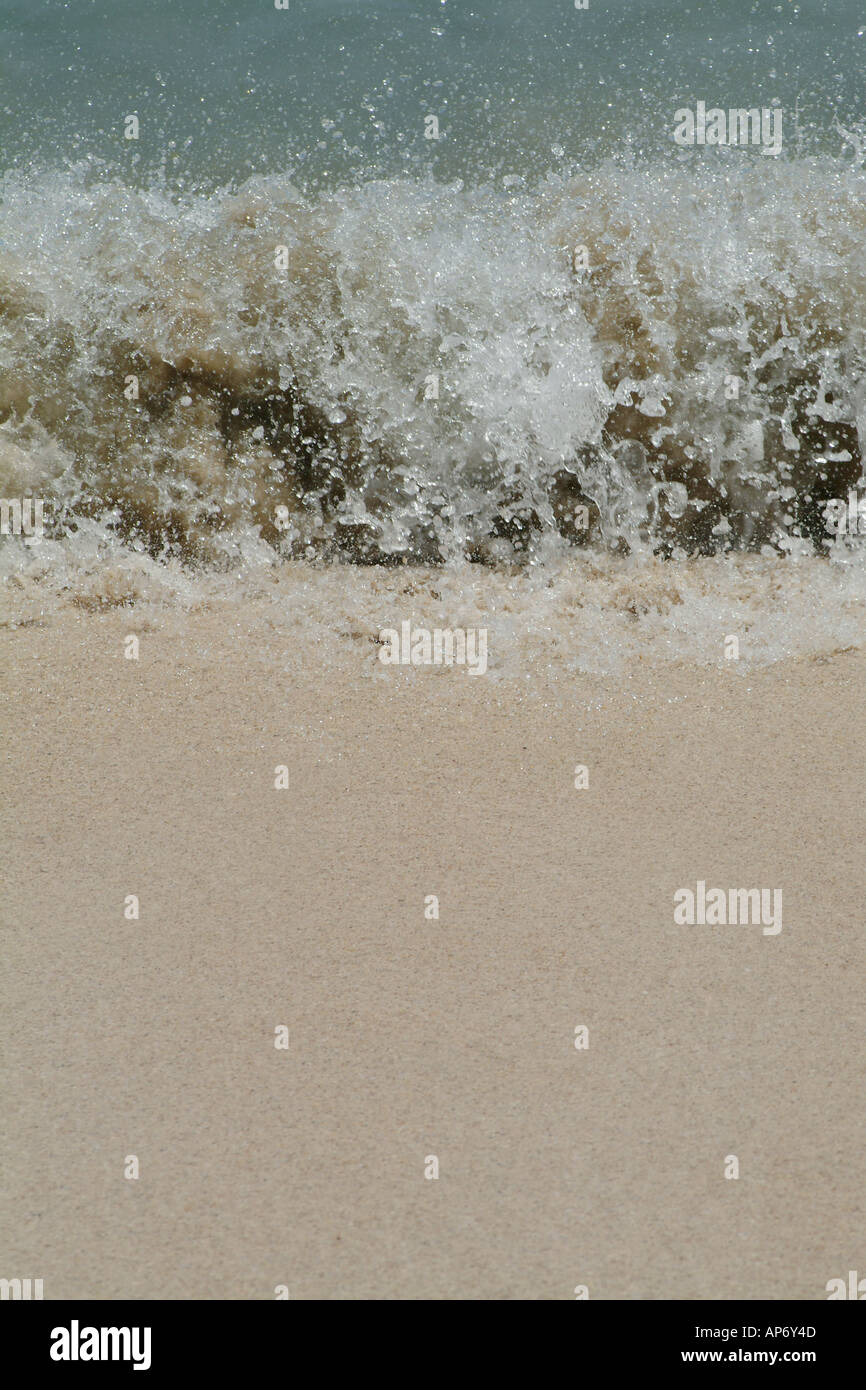 Wave breaks on a beach shoreline Stock Photo - Alamy