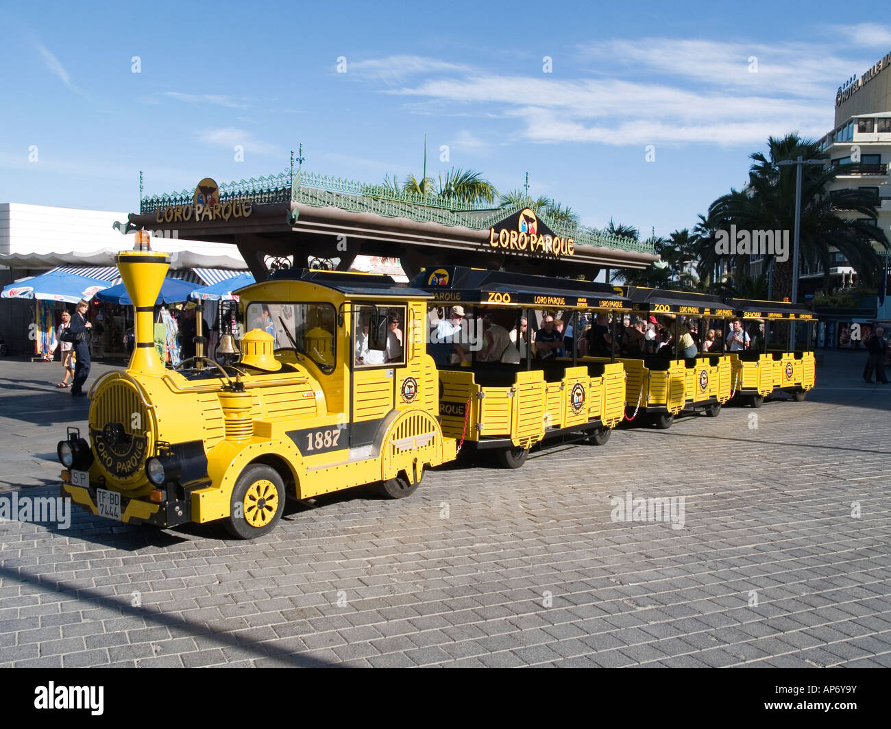 Yellow road train to take customers for the Loro Parque zoo to the ...