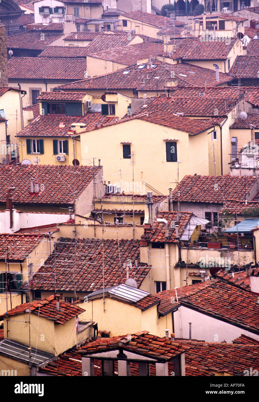 City scape of terracotta rooftops and yellow houses in Florence Italy ...