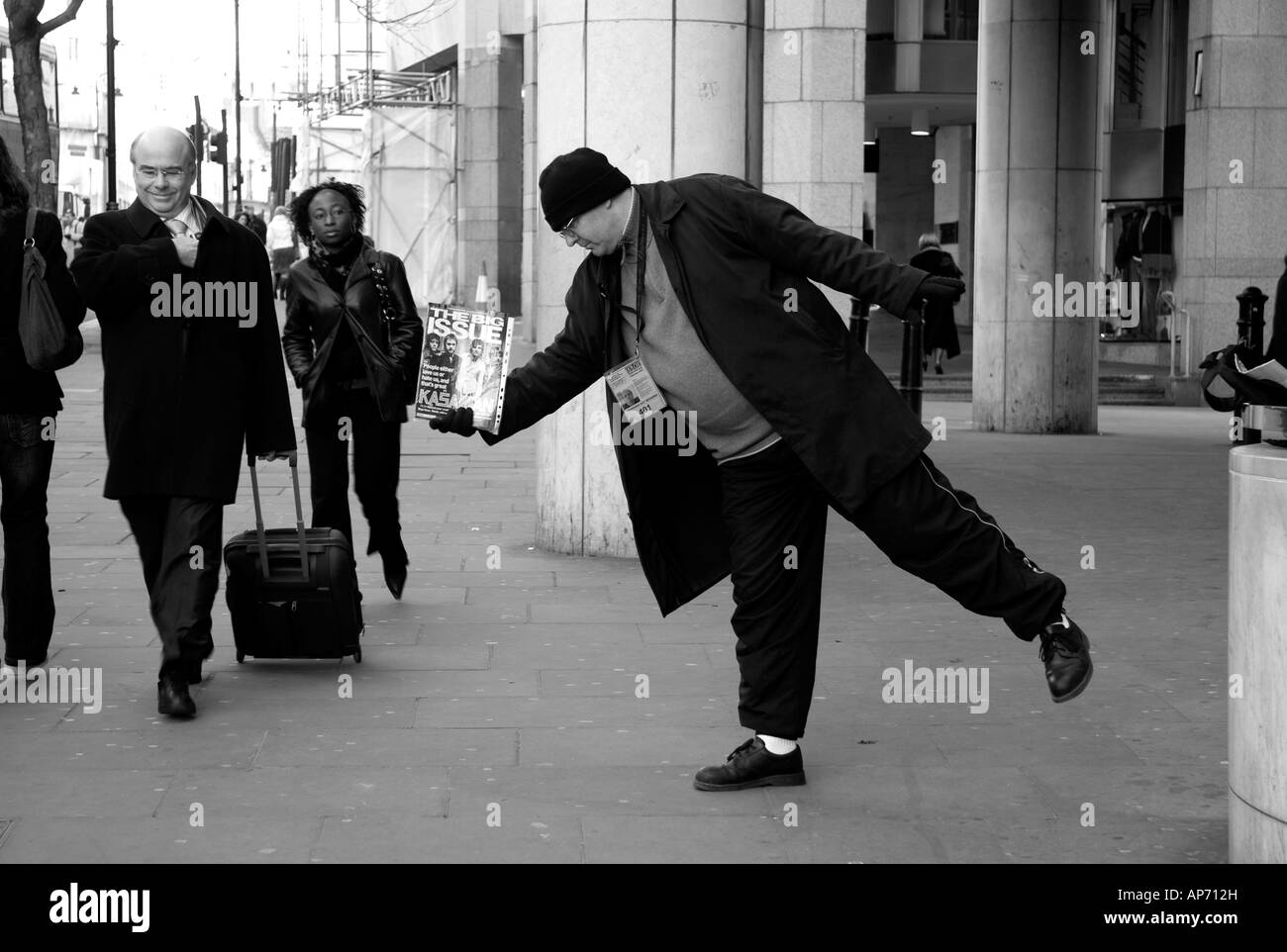 man selling big issue on one leg Stock Photo - Alamy