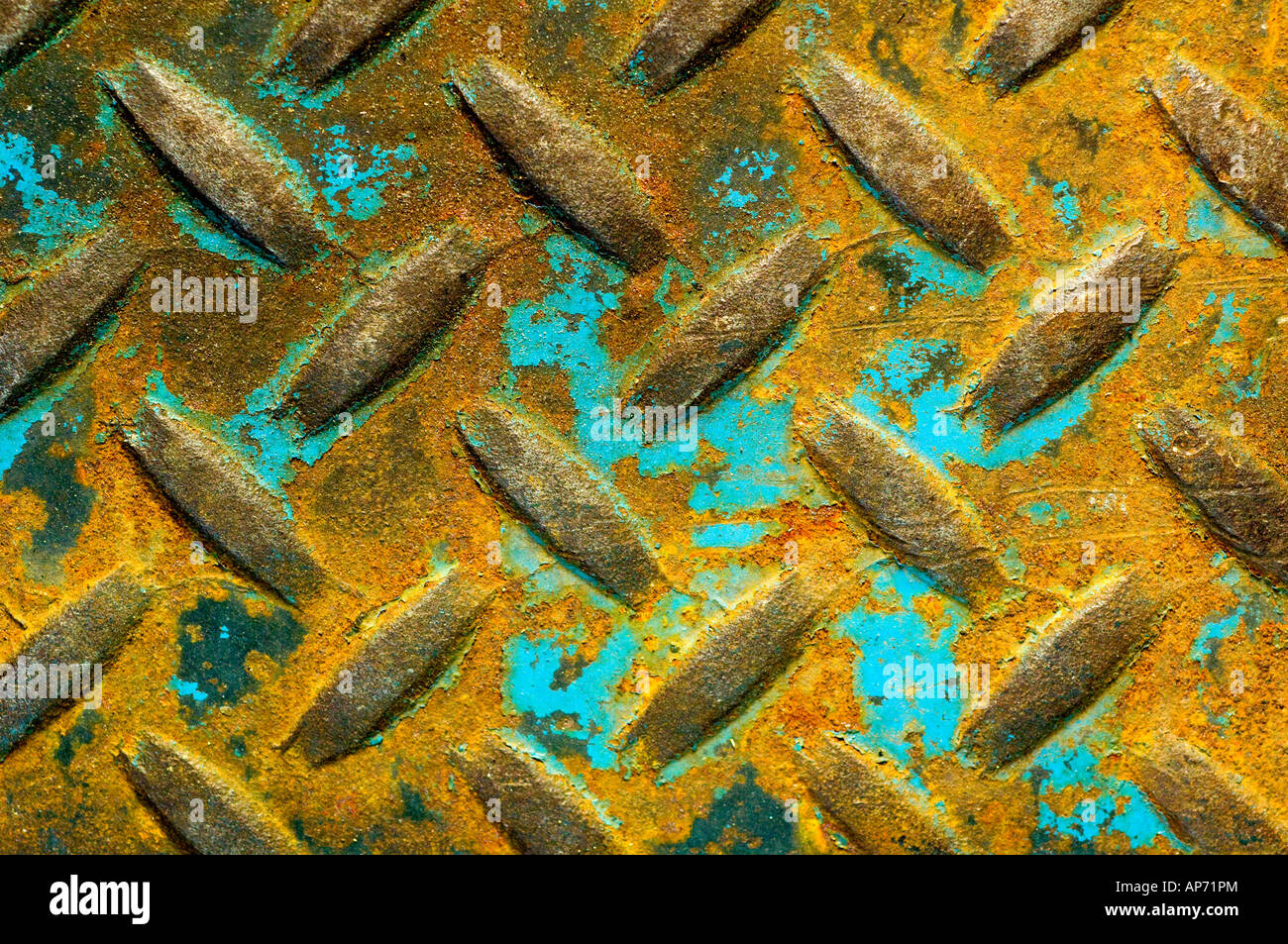 Turquoise paint on rusted patterned metal Stock Photo - Alamy