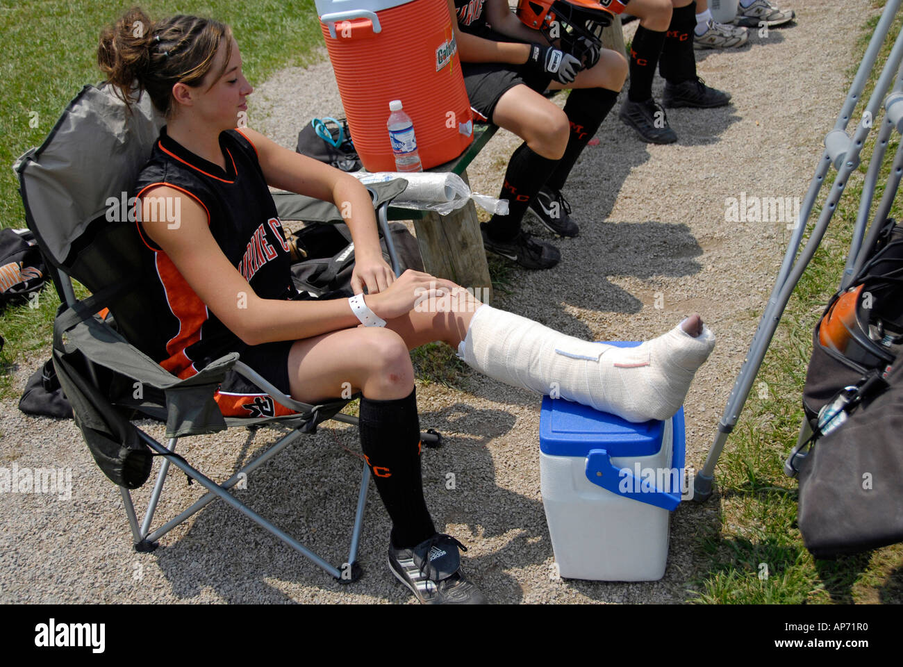 Female softball player sprains ankle from Sports injury due to playing ...
