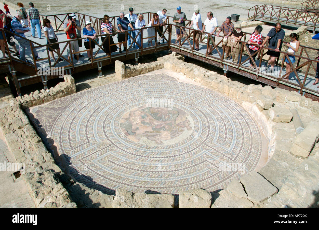 Tourists look at Roman mosaic in Villa of Theseus at ancient site of ...