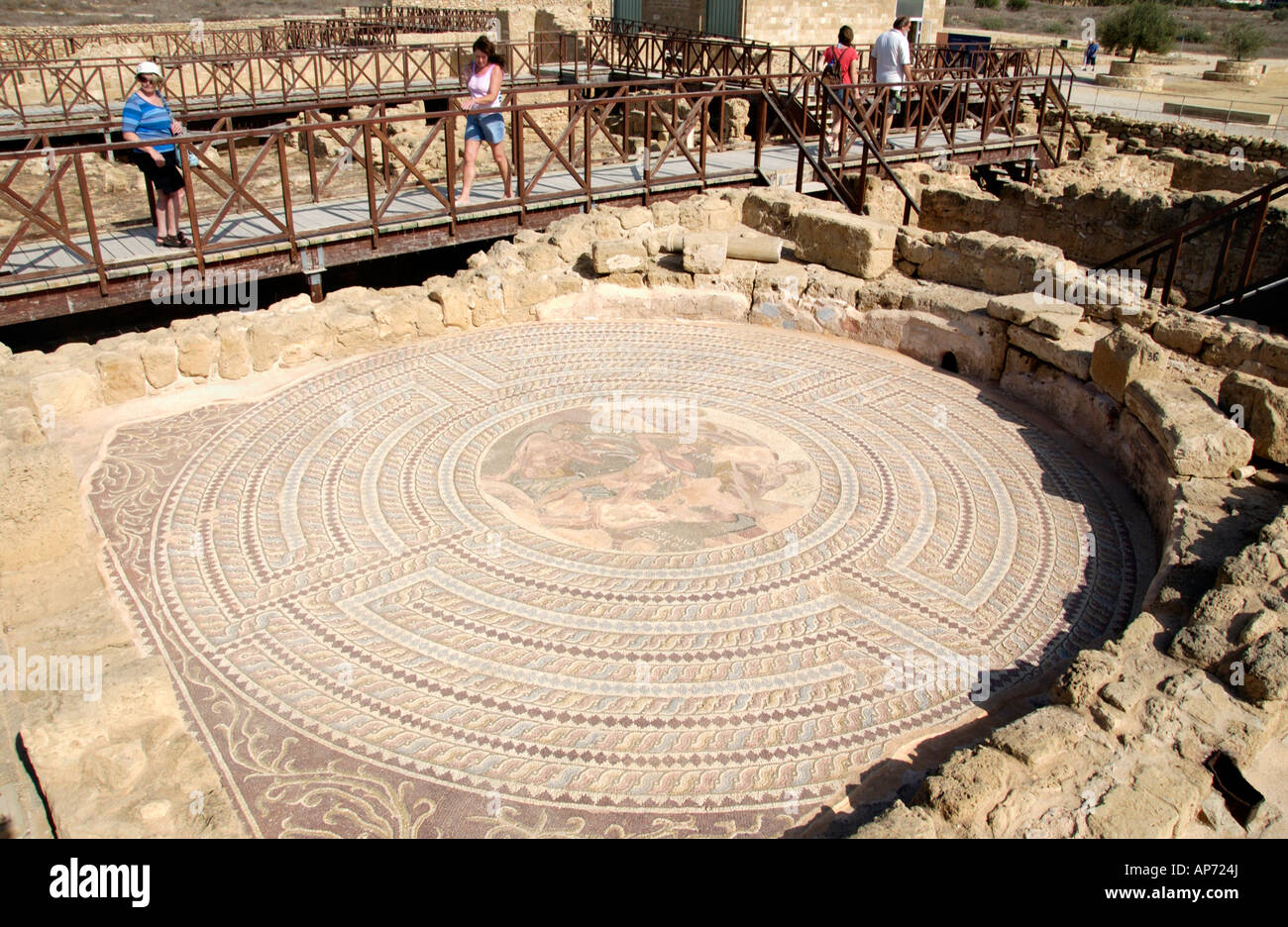 Tourists look at Roman mosaic in Villa of Theseus at ancient site of ...