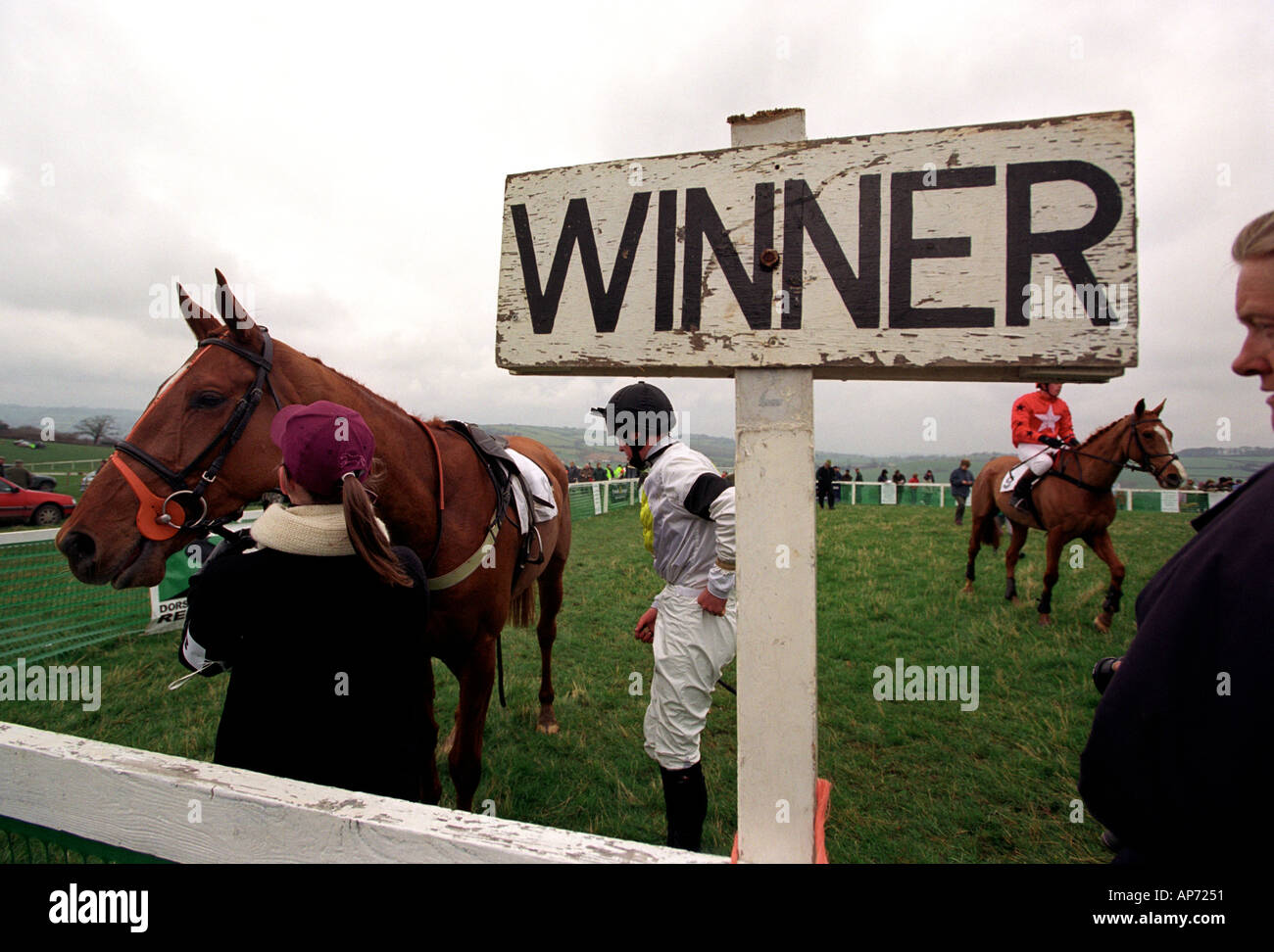 Horse and rider by a winner sign at a race meet Stock Photo - Alamy