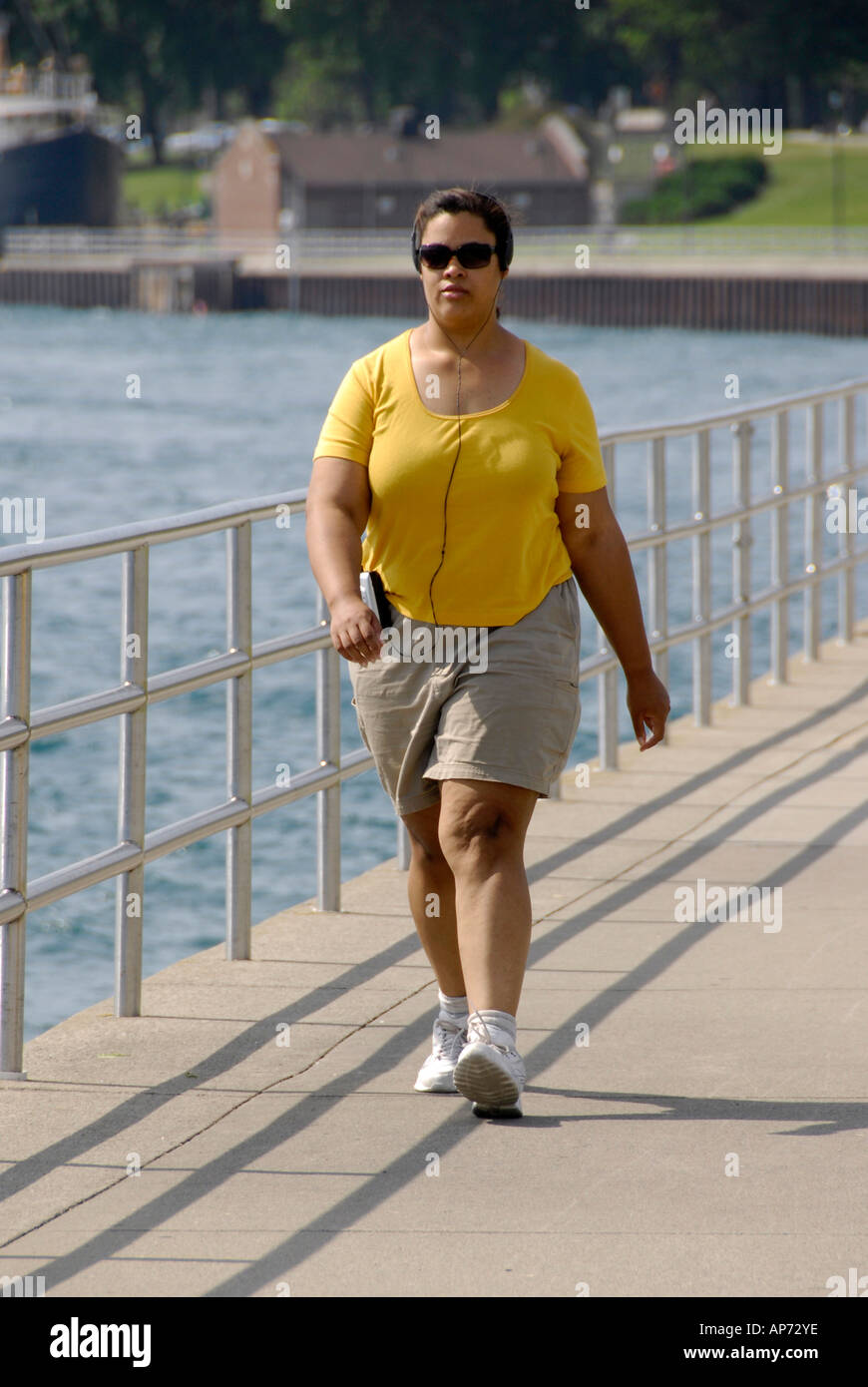 Overweight adult female walks for health and exercise Stock Photo - Alamy