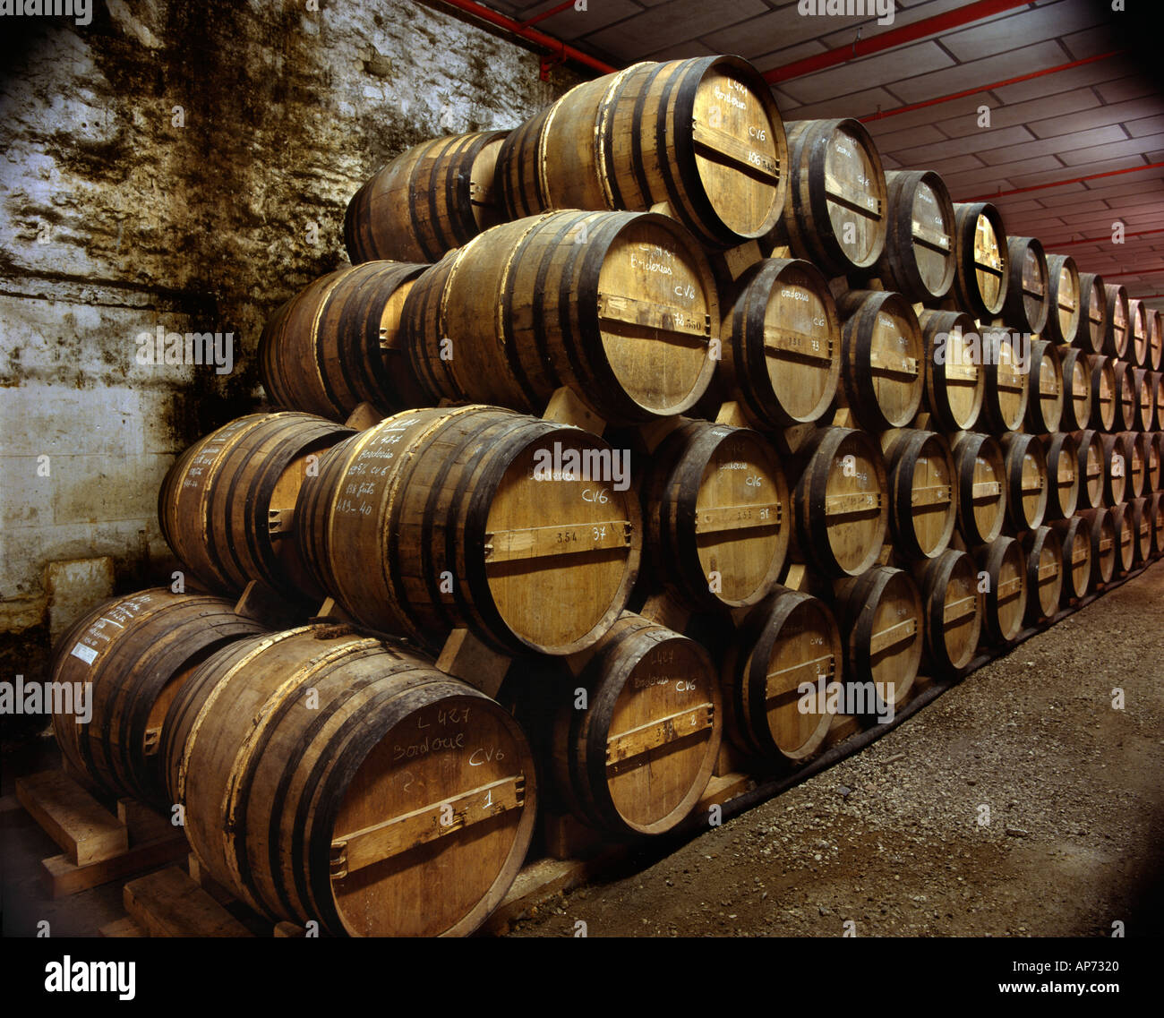 Cognac from the Borderies area ageing in barrels in one of the ...