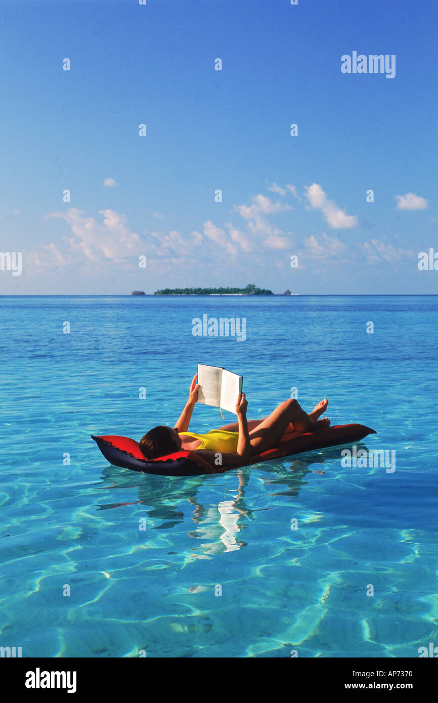 Woman floating in the air book hi-res stock photography and images - Alamy