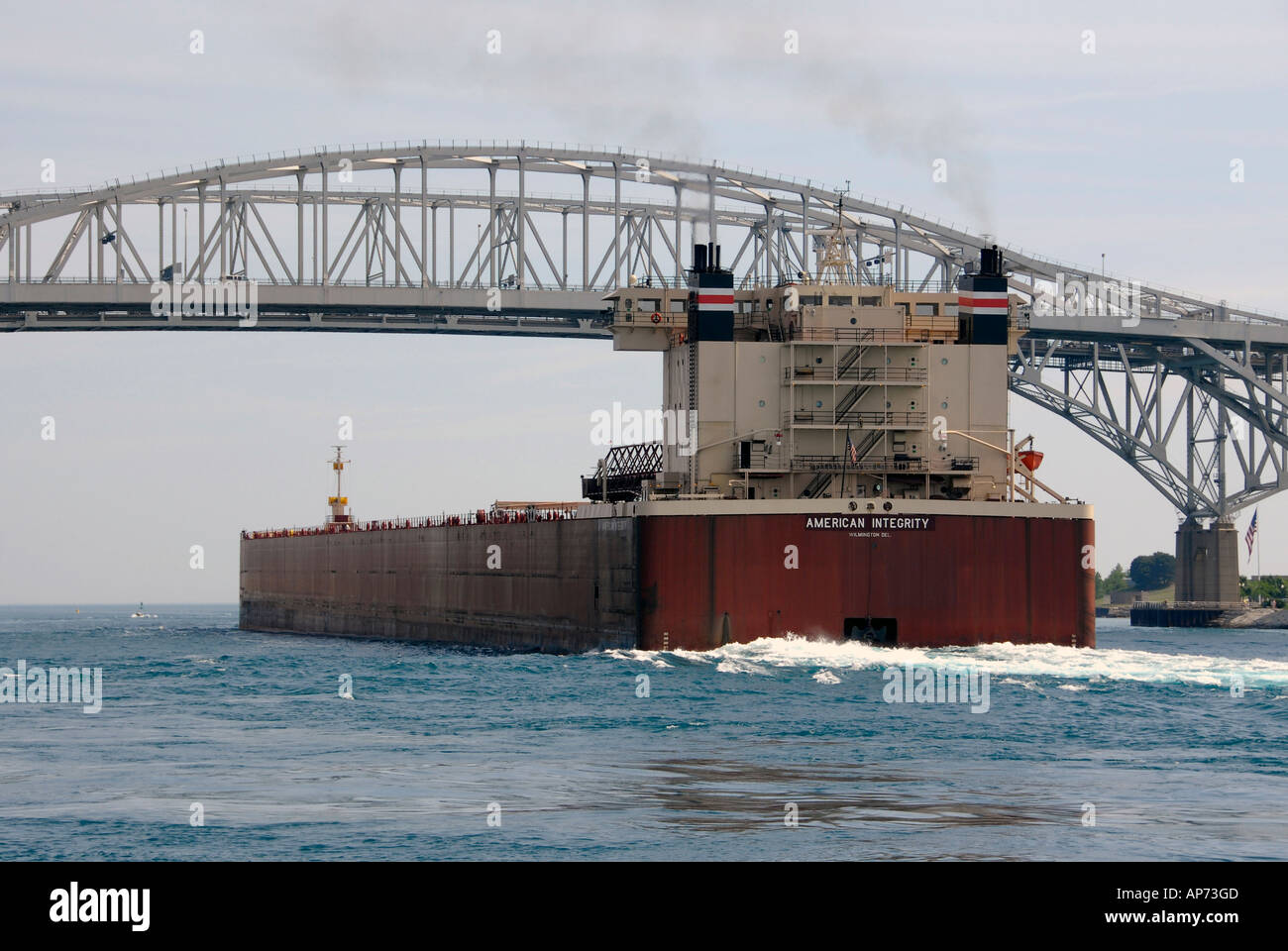 Giant lake freighter travel on the Great Lakes to provide shipping of ...