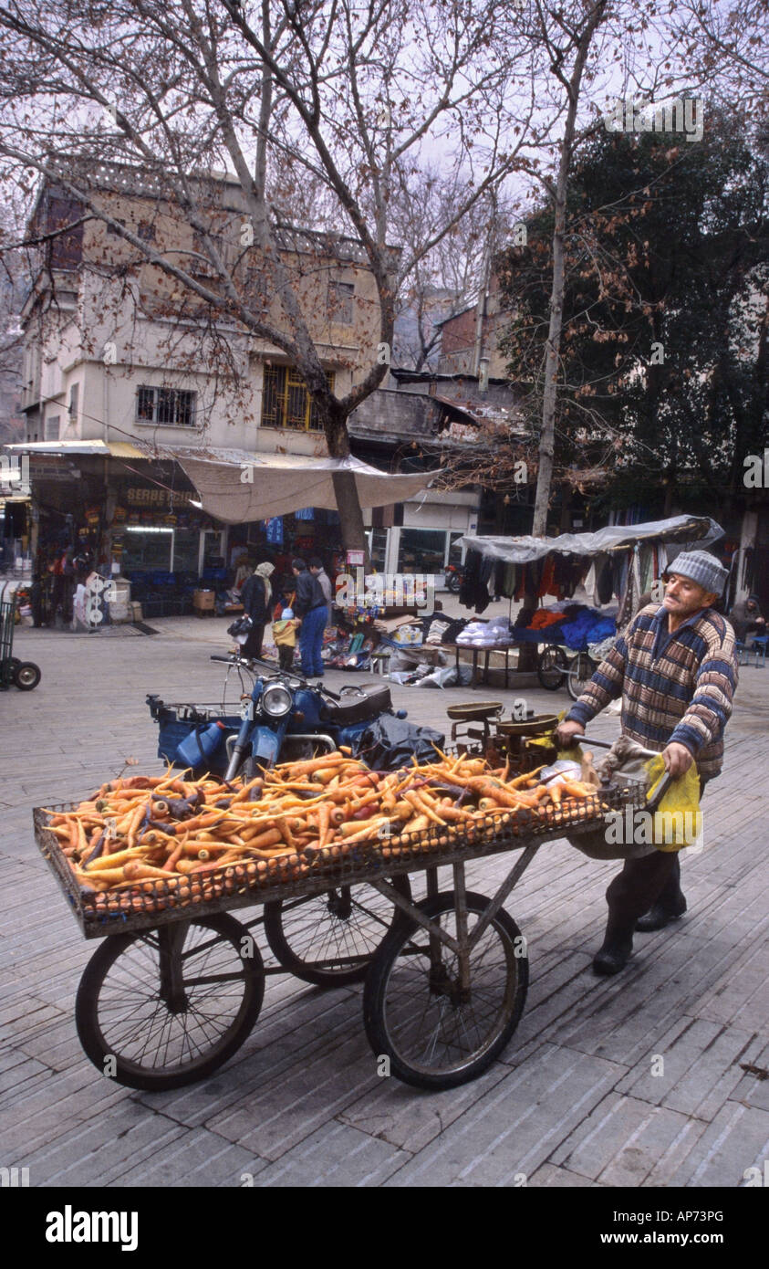 Man pushing barrow of fruit in market, Karamanmaras, Turkey Stock Photo ...
