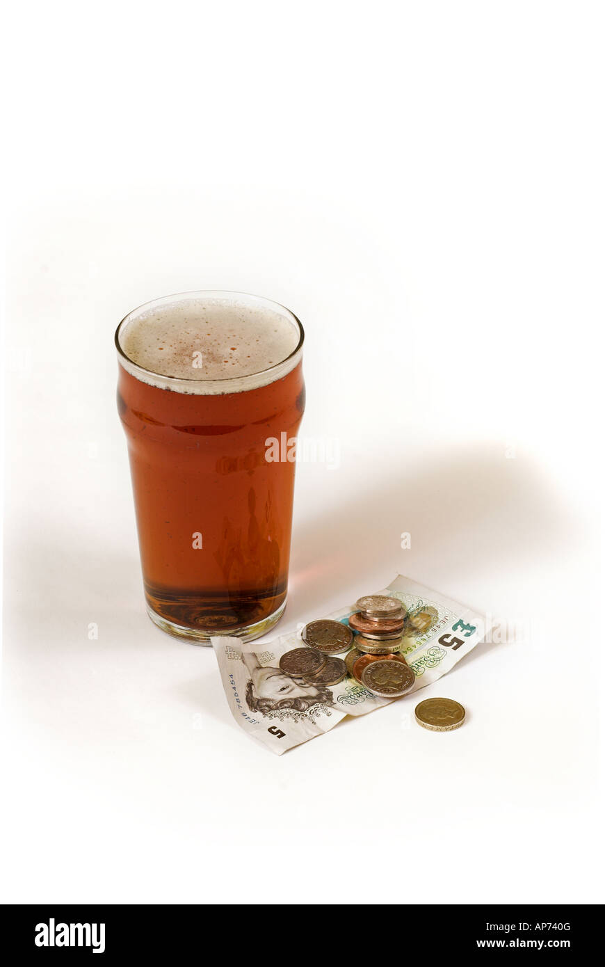 Pint of british beer with money Stock Photo - Alamy