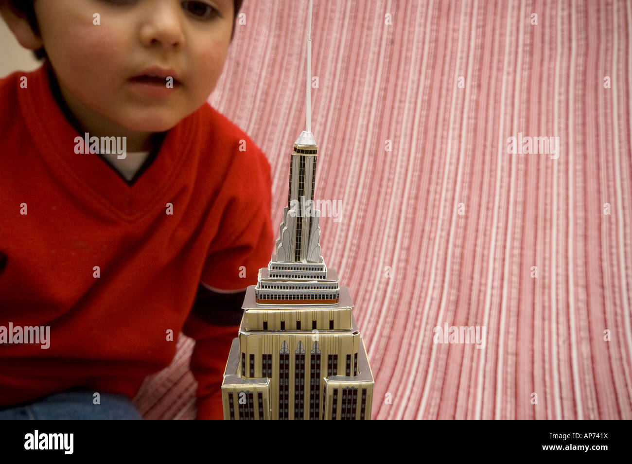 Kid Playing With Cardboard Model Empire State Building Stock Photo - Alamy