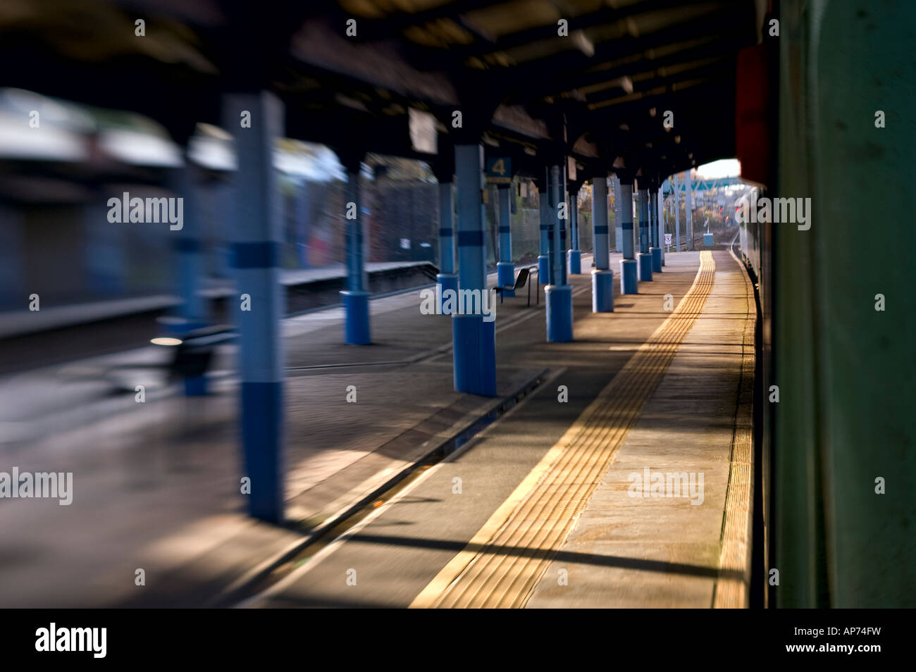 Train Passing Through Station on Route to London Stock Photo - Alamy