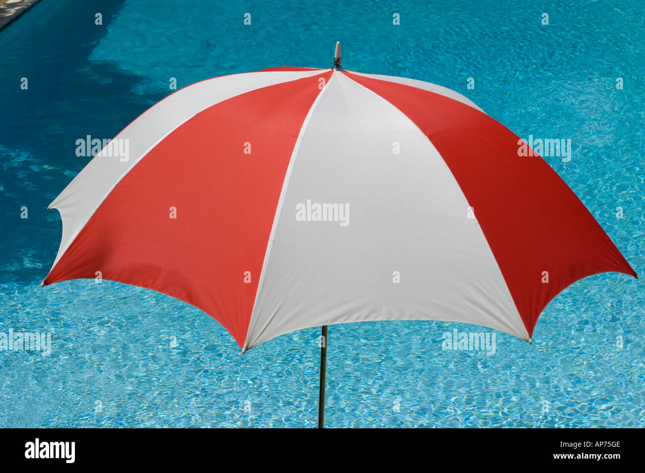 large colorful umbrella by resort pool Stock Photo - Alamy