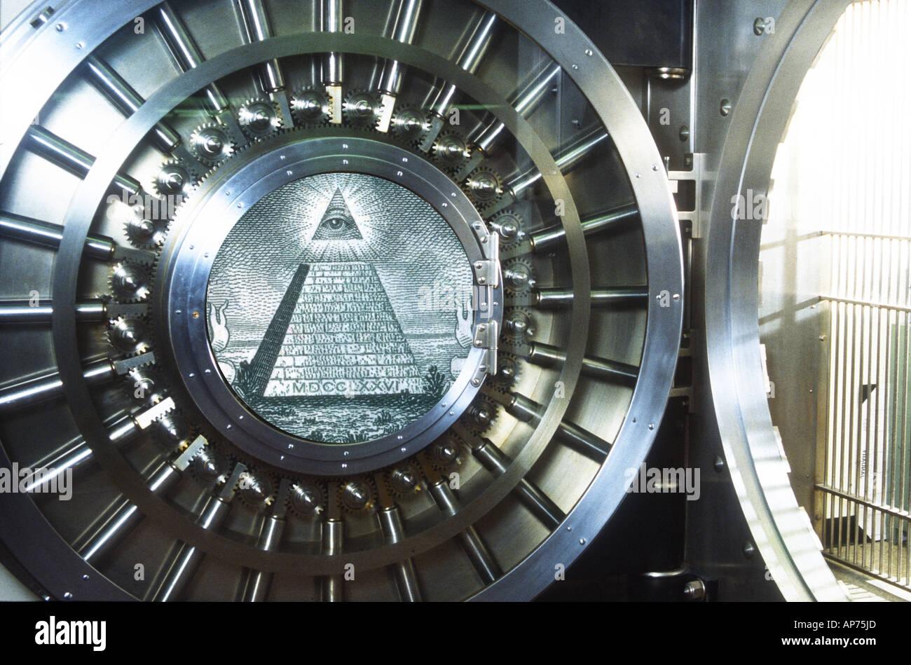 heavy steel round vault door in bank with US dollar pyramid symbol ...