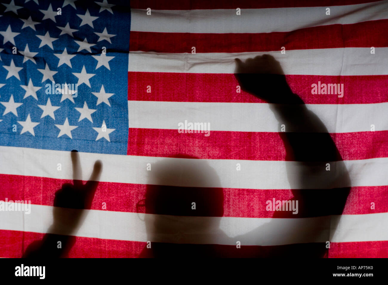conceptual view of silhouette of a man behind United States flag in ...