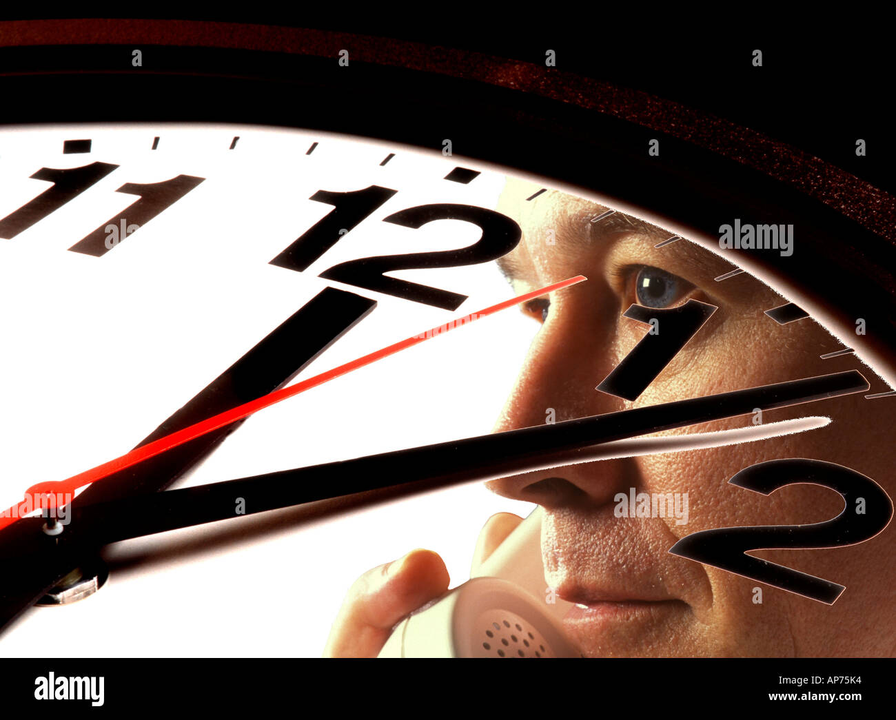 male business executive on telephone composited on large office clock ...