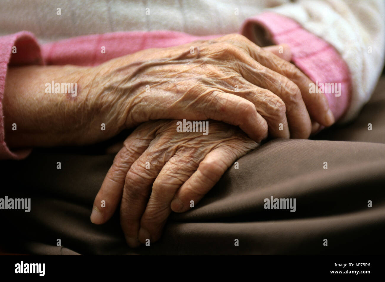 Elderly woman hands lap hi-res stock photography and images - Alamy
