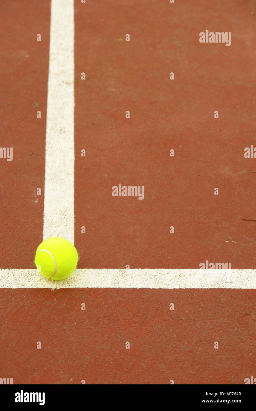 tennis ball on line field Stock Photo - Alamy