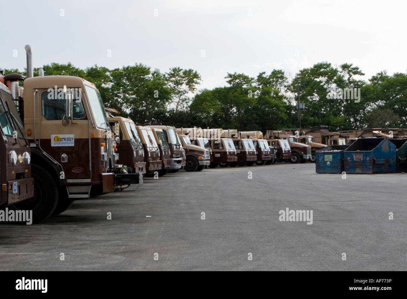 Row of Garbage Trucks Lined up in Sanitation Yard Stock Photo - Alamy