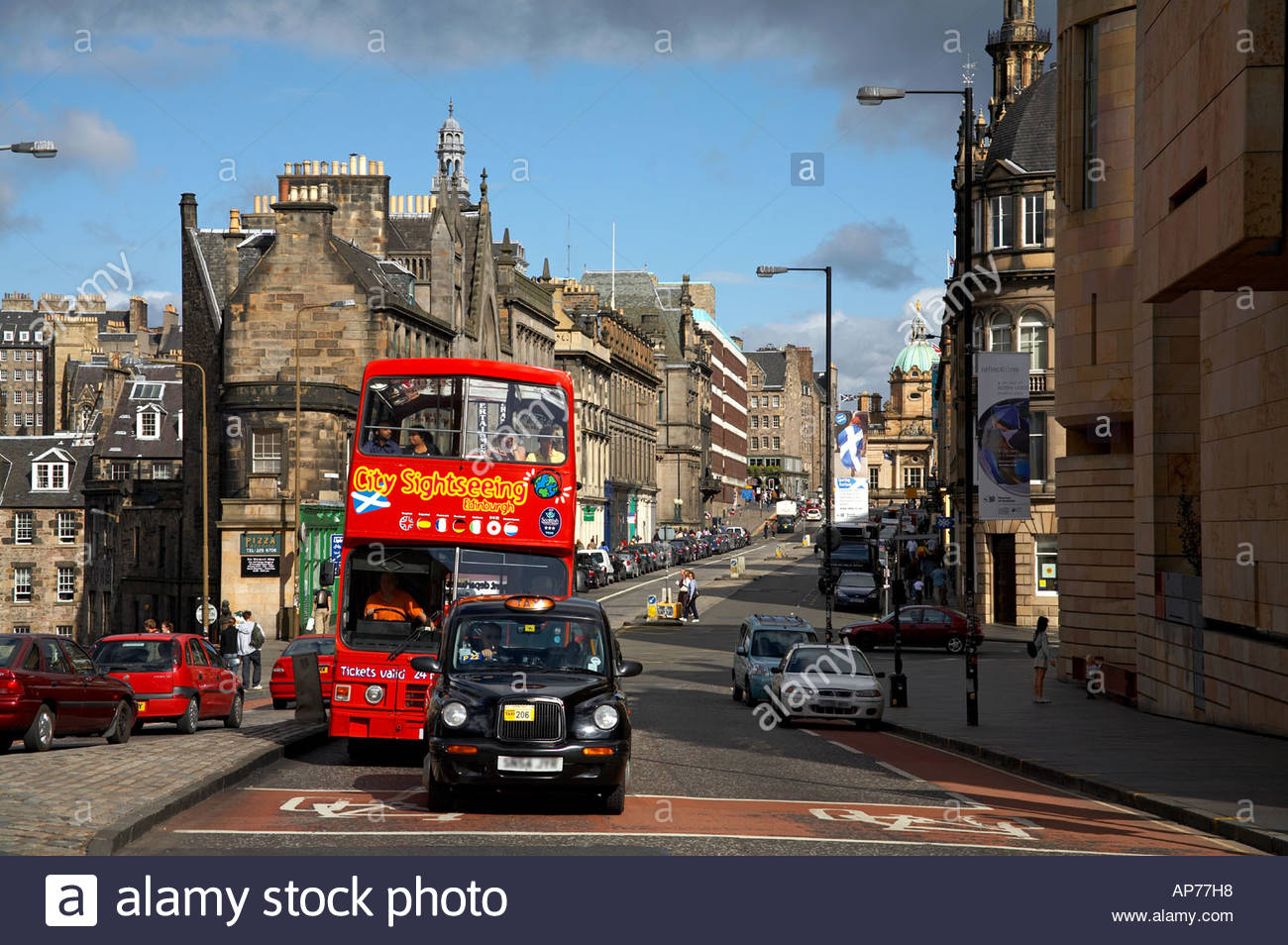 A red tourist bus and black taxi on King George IV bridge, Edinburgh ...