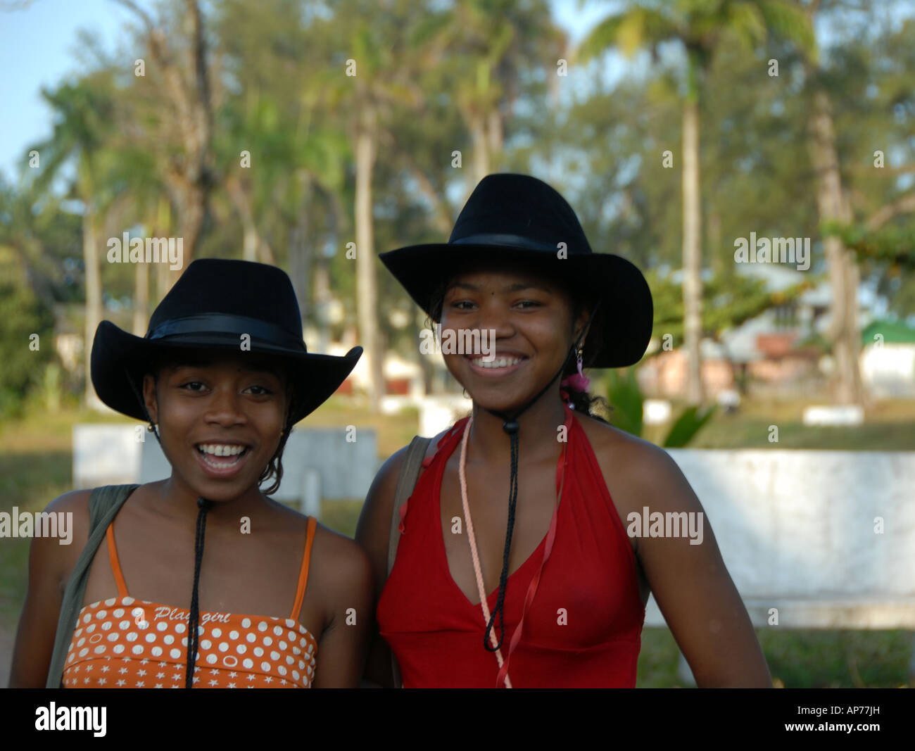 Two girls in cowboy hats, Manakara, Eastern Madagascar Stock Photo - Alamy