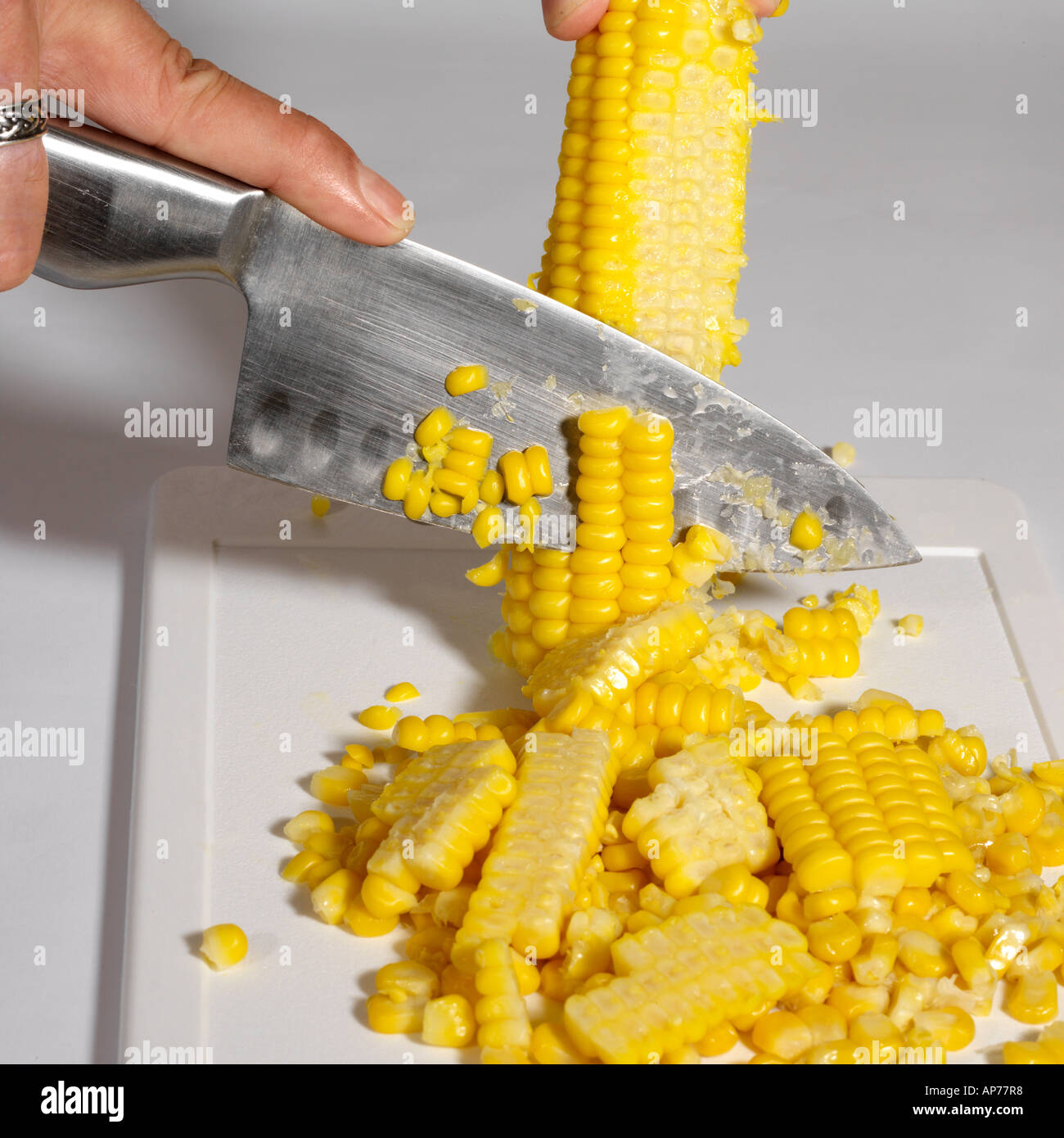 Cutting corn off the cob Stock Photo - Alamy