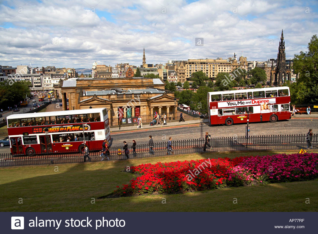 Two red tourist buses on The Mound, Edinburgh SCOTLAND Stock Photo - Alamy