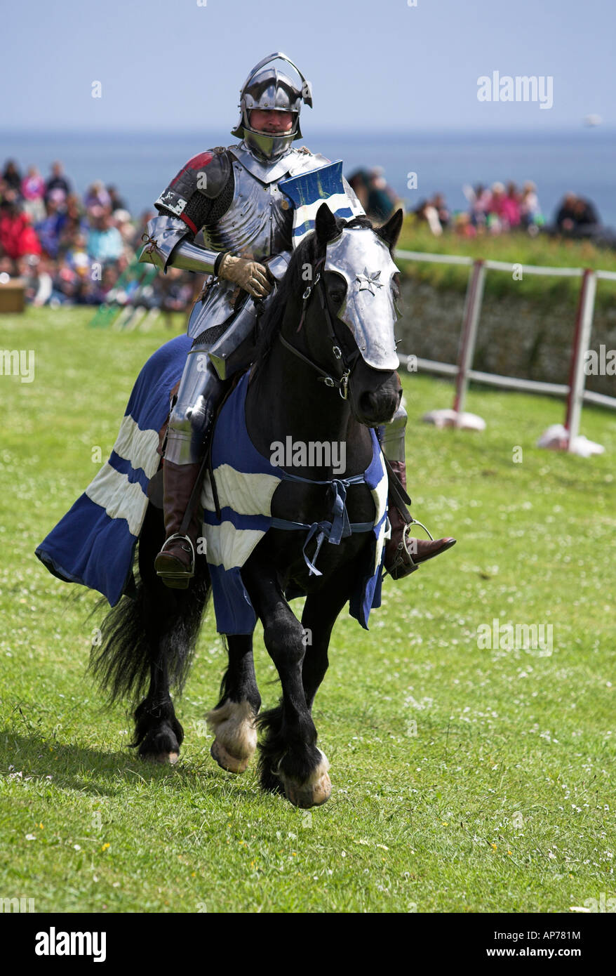 Modern medieval knight in armour on horseback, competing in a jousting ...