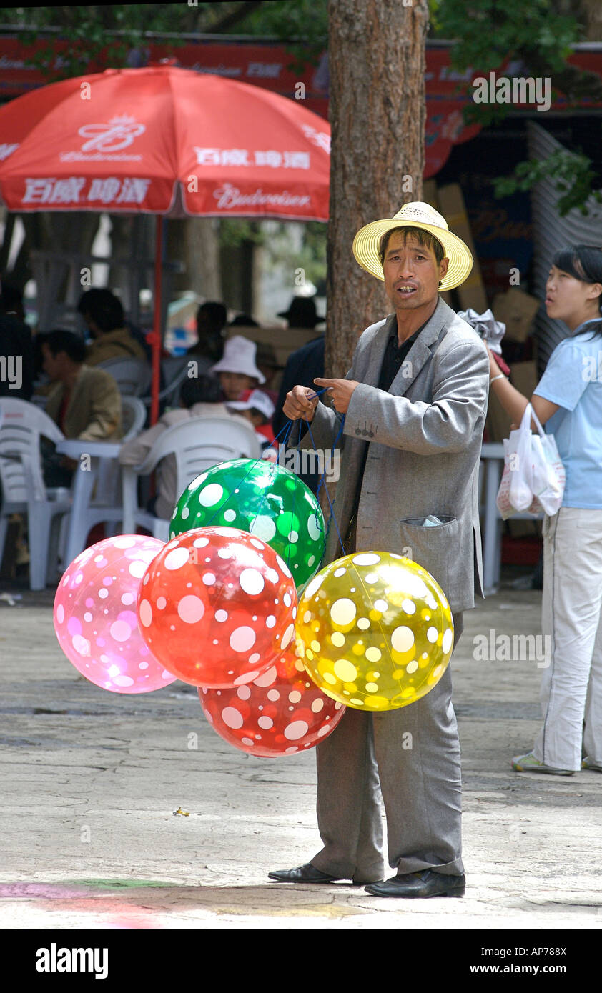 Balloon seller at the Summer Palace Lhasa Tibet Stock Photo - Alamy