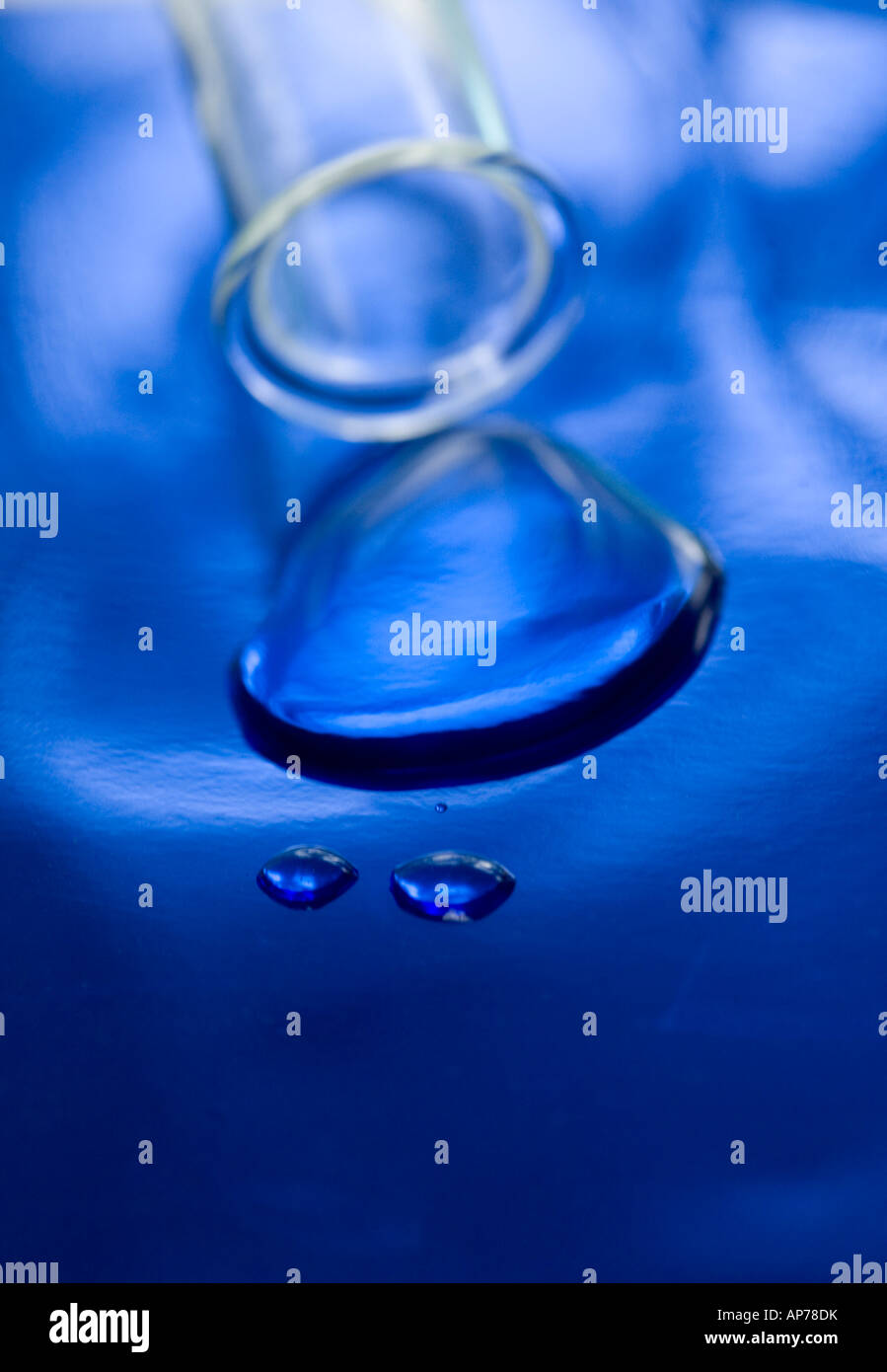spill from test tube blue droplets water chemical or corrosive or oil ...