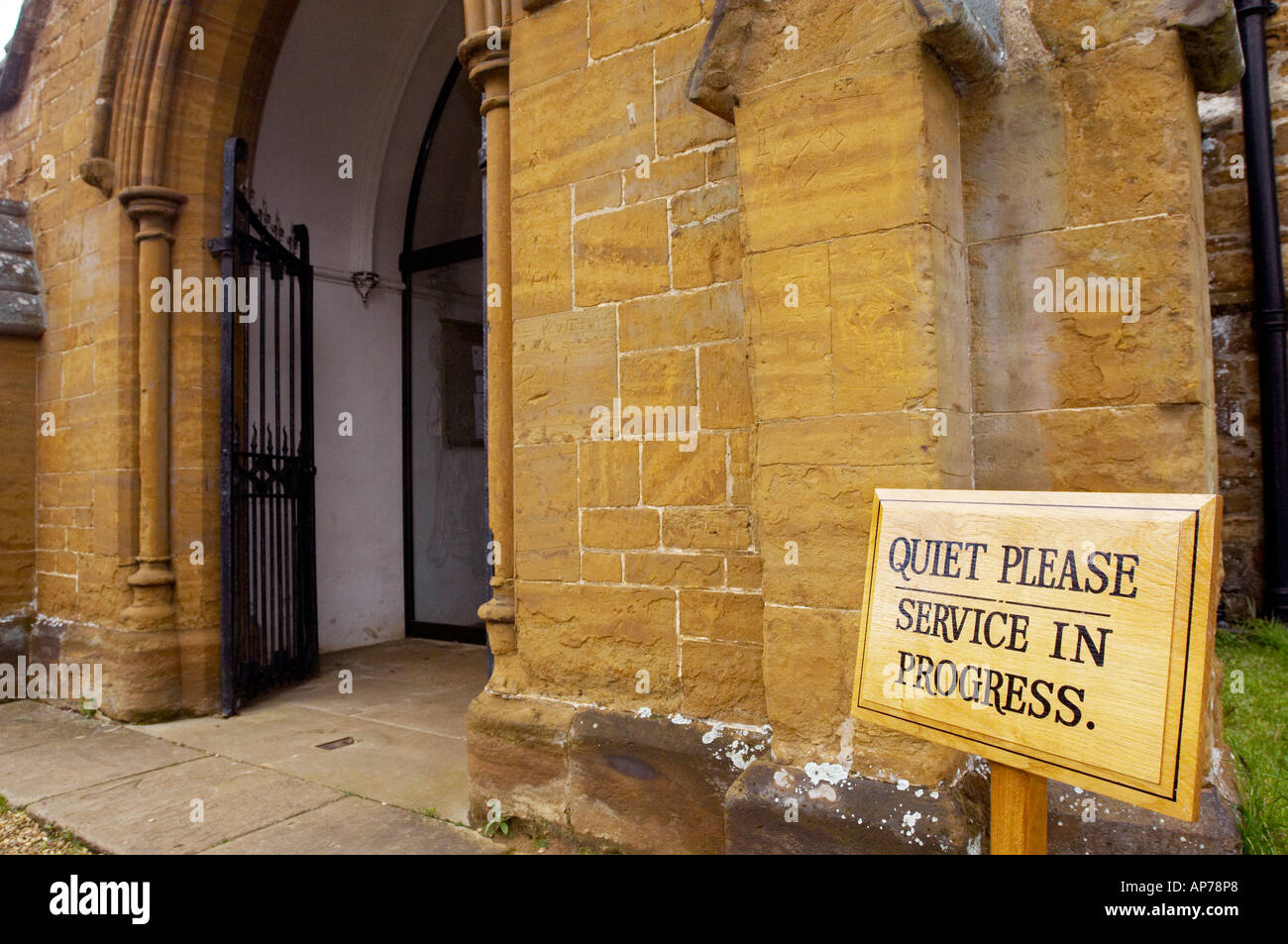 Wooden sign with the wording Quiet Please Service in Progress, placed ...