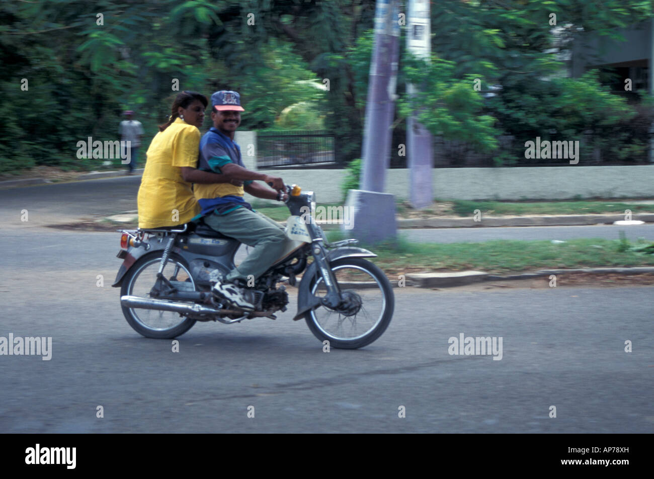 Woman riding small motorcycle hi-res stock photography and images - Alamy