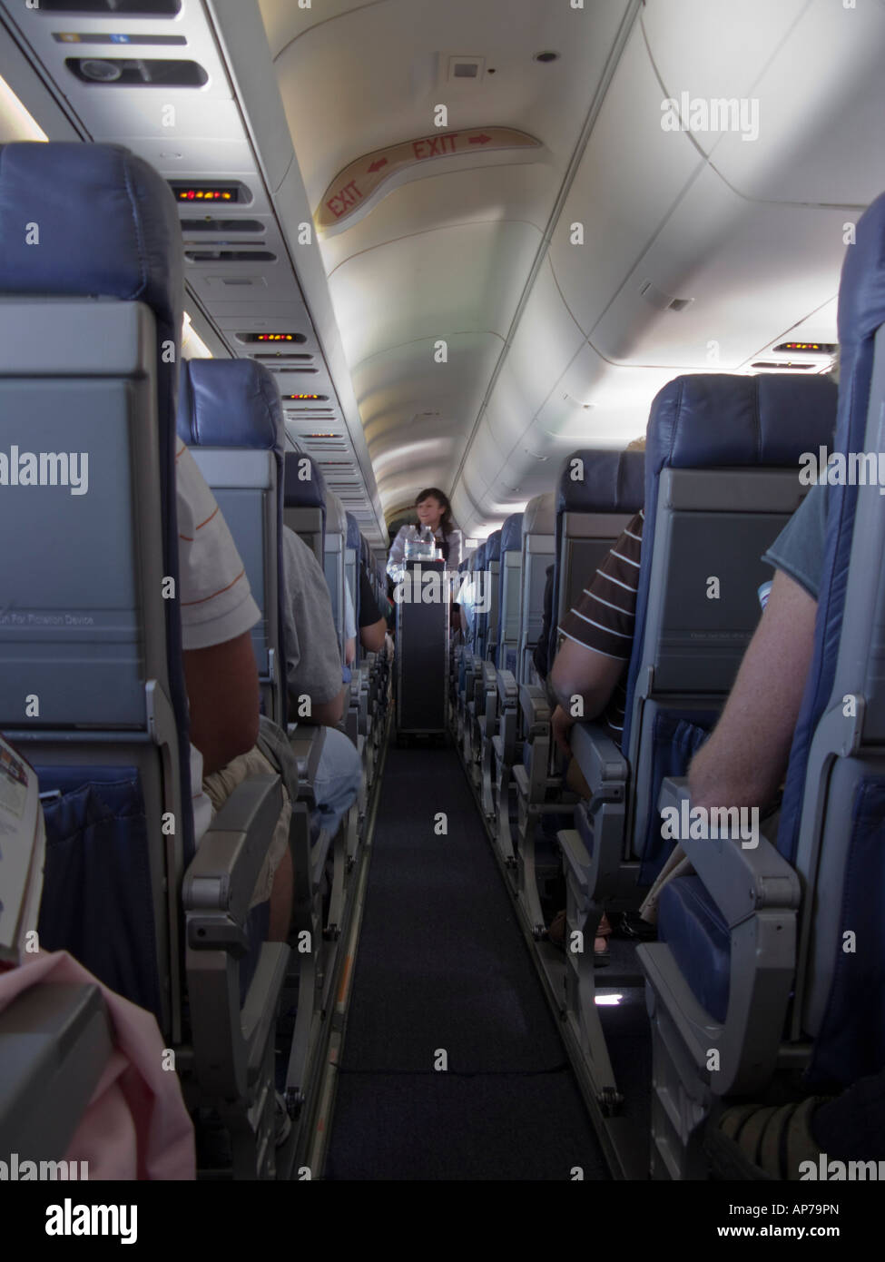 Service cart in isle of small commuter jet Stock Photo - Alamy