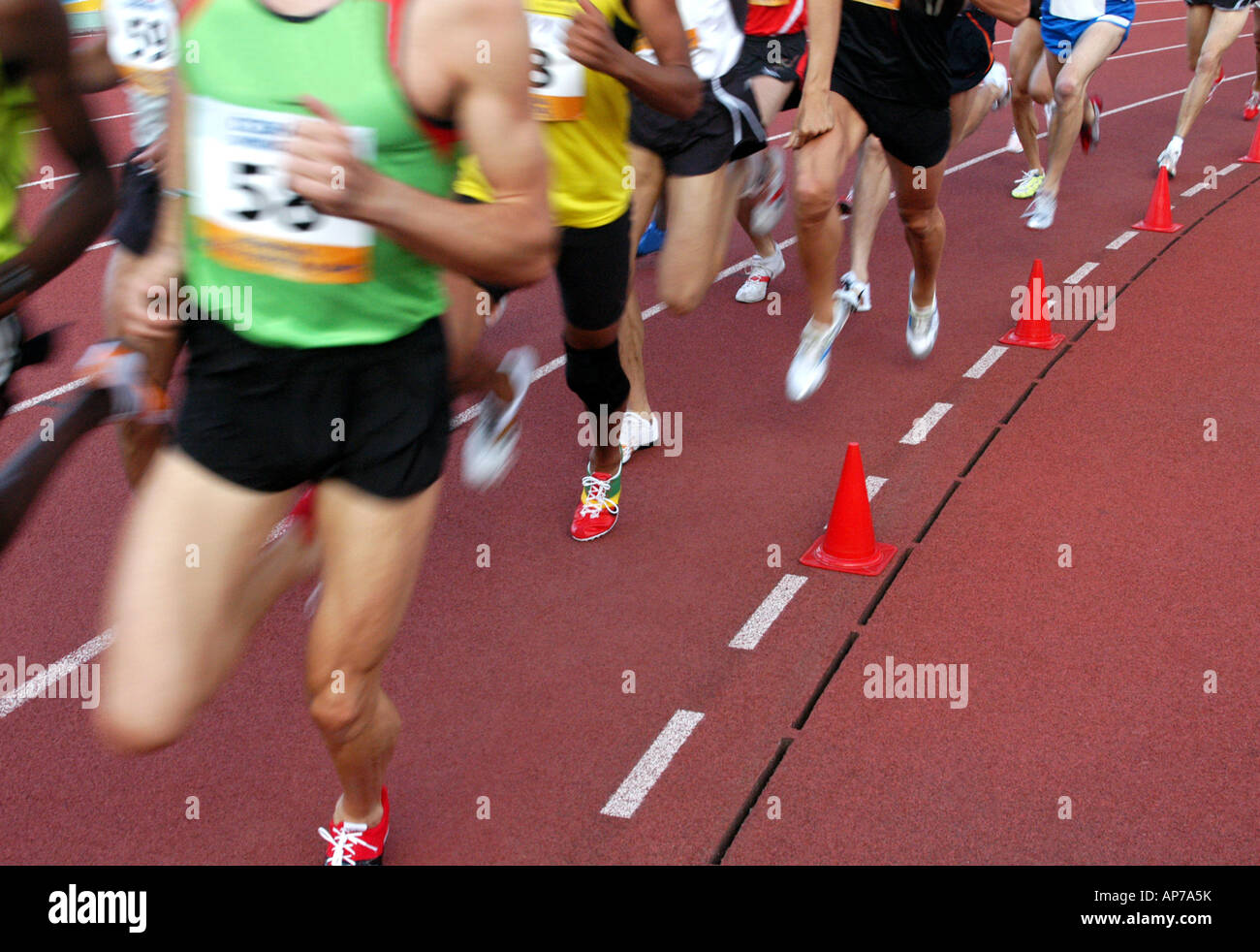 Running athletes at the stadium Stock Photo - Alamy