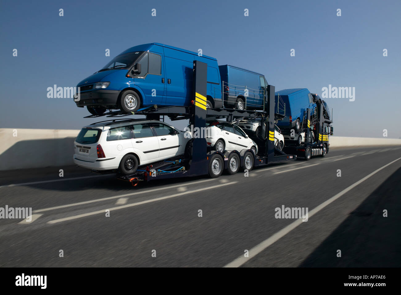 Car Transporter delivering cars Stock Photo - Alamy