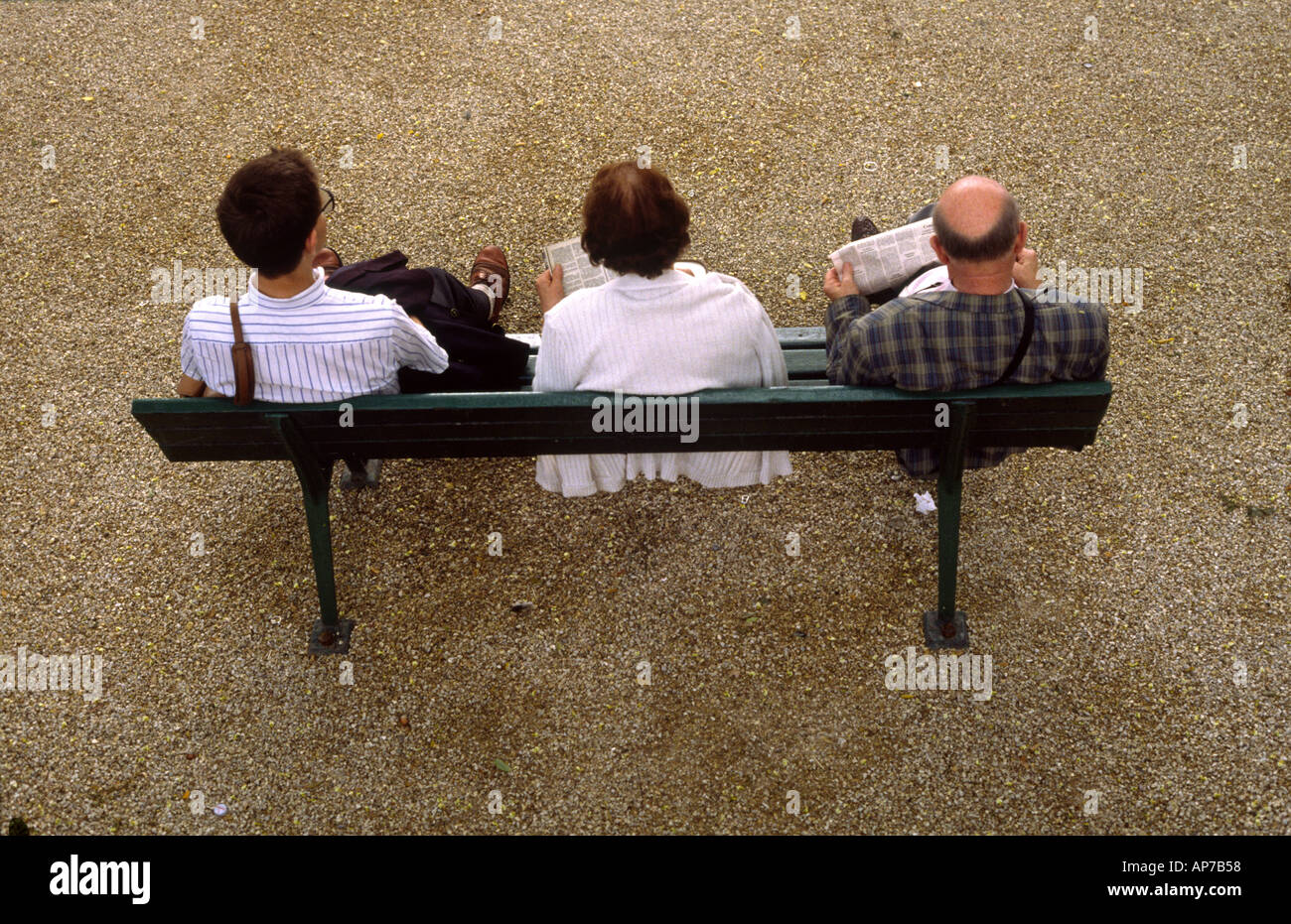 Three people seated on bench hi-res stock photography and images - Alamy