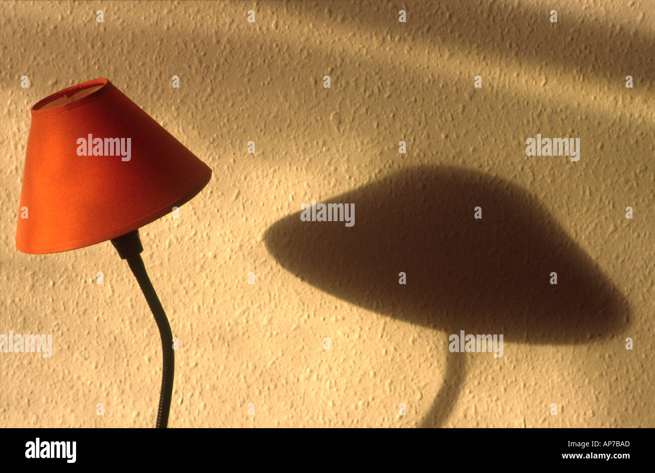 Lampshade shadow orange Stock Photo - Alamy