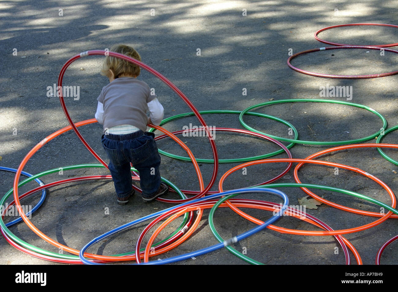 Child with hula hoop hi-res stock photography and images - Alamy