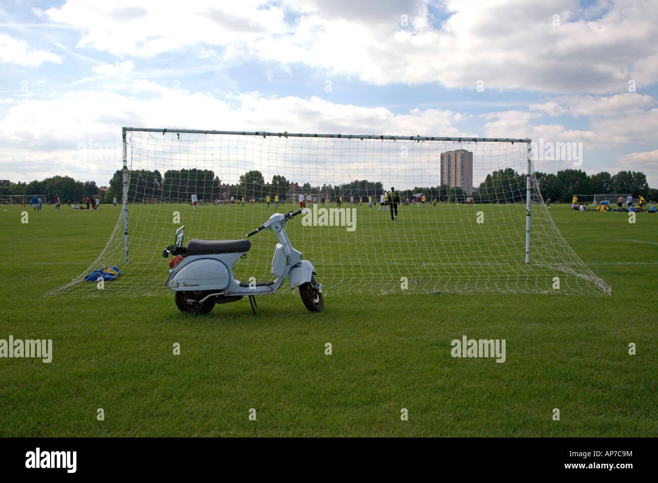 Vespa motor scooter by goal net on soccer pitch Stock Photo - Alamy