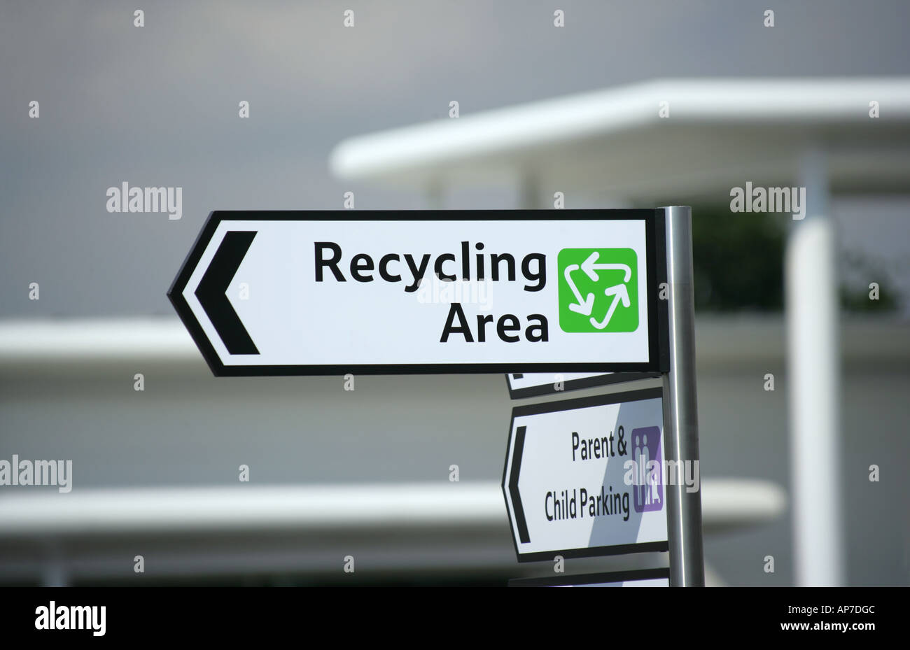 Signs for recycling area and parent & child parking in supermarket car ...